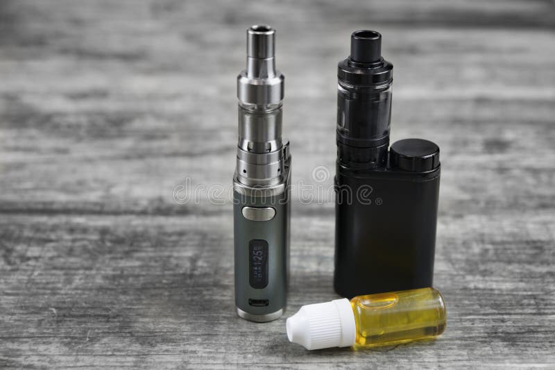 E - Cigarette for Vaping , Technical Devices.the Liquid in the Bottle ...