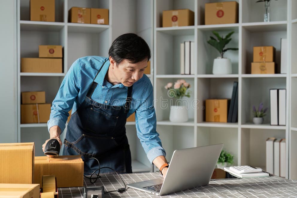 E-commerce Entrepreneur Scanning Products for Inventory Management in a Home Office, Optimizing ...