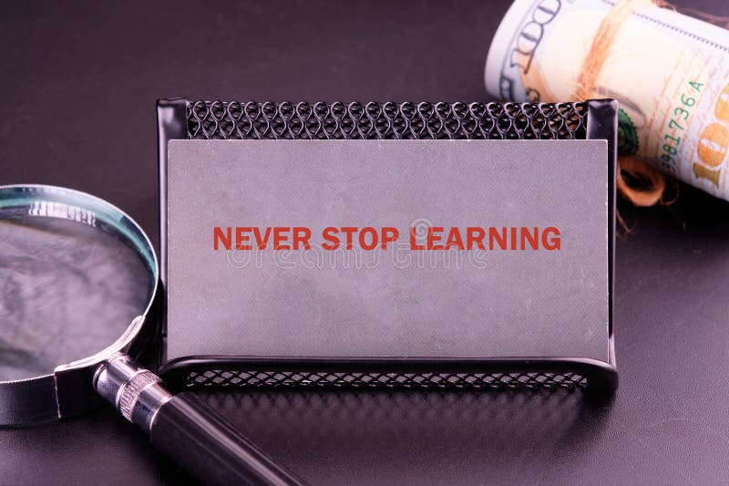 E-learning Education Concept. NEVER STOP LEARNING Written Message Close-up on a Gray Business ...