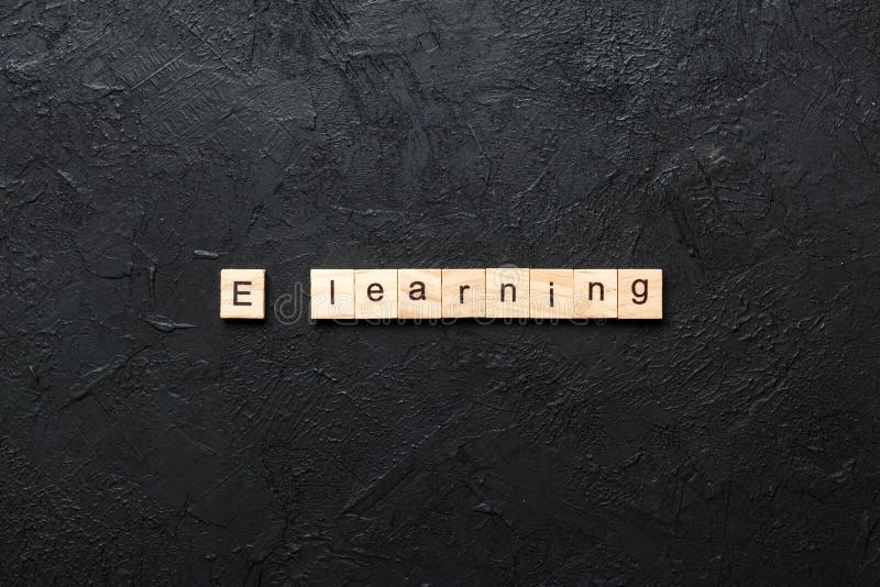 E Learning Word Written on Wood Block. Elearning Text on Cement Table ...