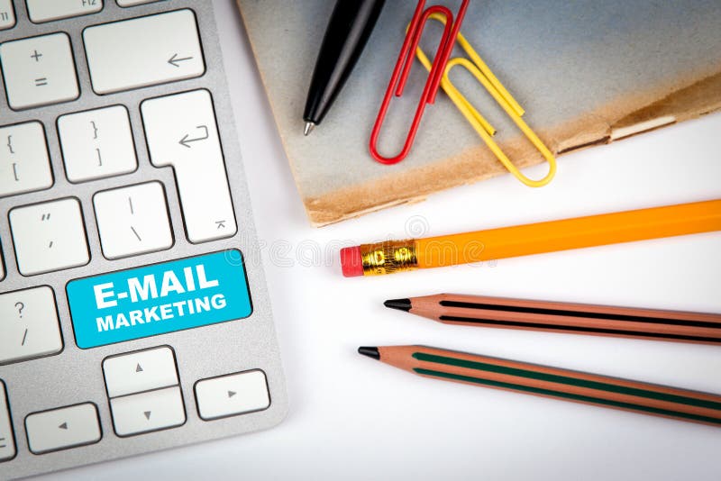 E-Mail Marketing Concept. Computer Keyboard on a White Office Desk with ...
