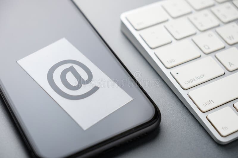 E-mail at sign on the desk stock image. Image of mail - 358701681