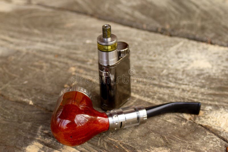 E-pipe with Blurred Background and Cup of Coffee in Natural Ambient ...