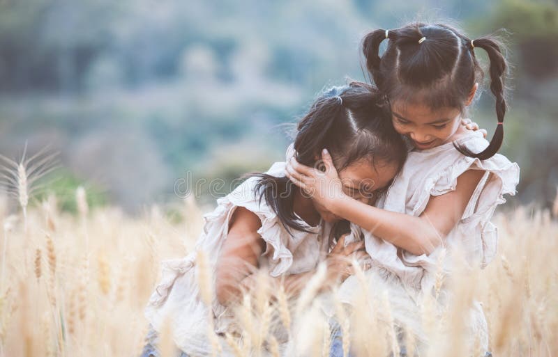 Two Asian Child Girls Hugging Each Other and Playing Together in the ...