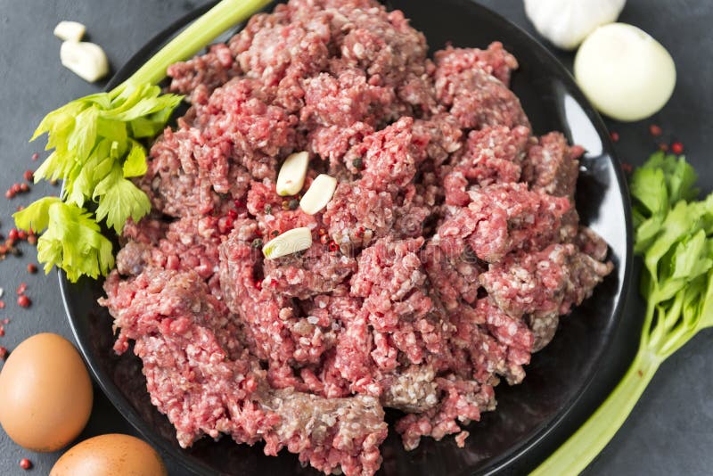 Raw Ground Beef in a Plate, Celery, Garlic Cloves, Eggs Onion, Meat ...