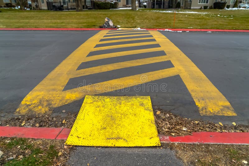 Yellow Diagonal Stripes between Parallel Lines Painted on a Paved Road ...