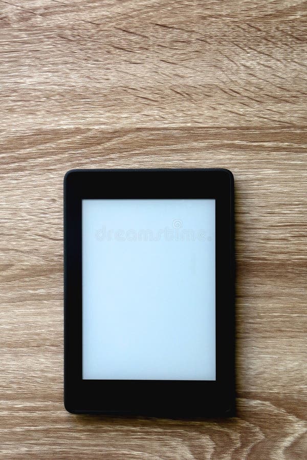 E-Reader on Wooden Background Stock Photo - Image of flat, device ...