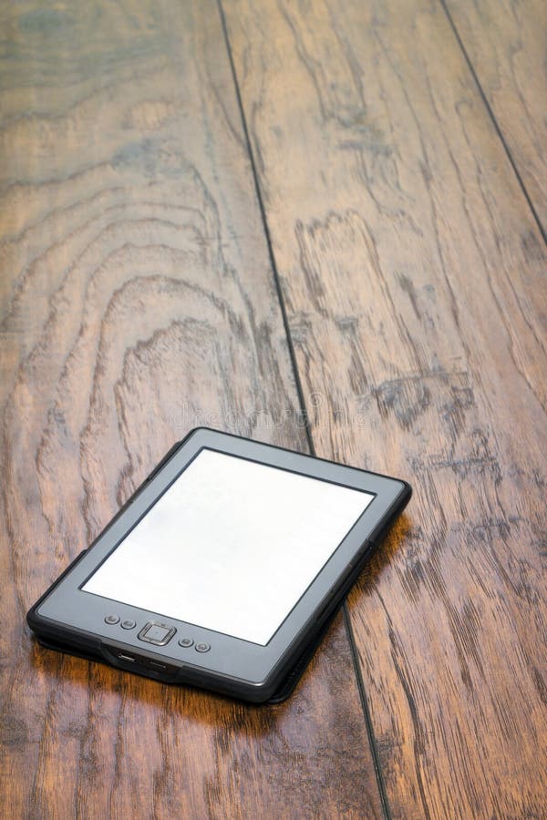 E-Reader on Wooden Background Stock Photo - Image of abstract, screen ...