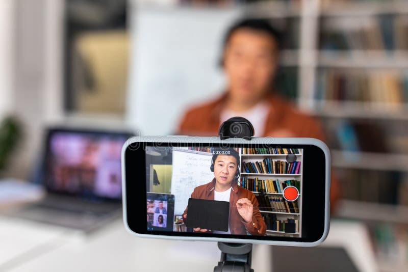 Closeup of Smartphone with Asian Teacher Man on Screen Indoor Stock ...