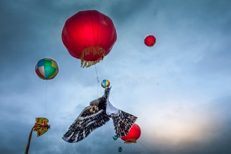 Eagle Shaped Kite with Balloons Flying in the Sky Stock Image - Image ...