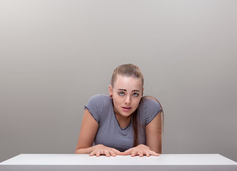 Eaning in, Her Tense Posture Screams Apprehension Stock Image - Image ...