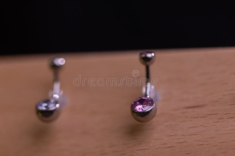 Ear Jewelry, Piercing in Hand with a Disposable Glove. Stock Photo ...