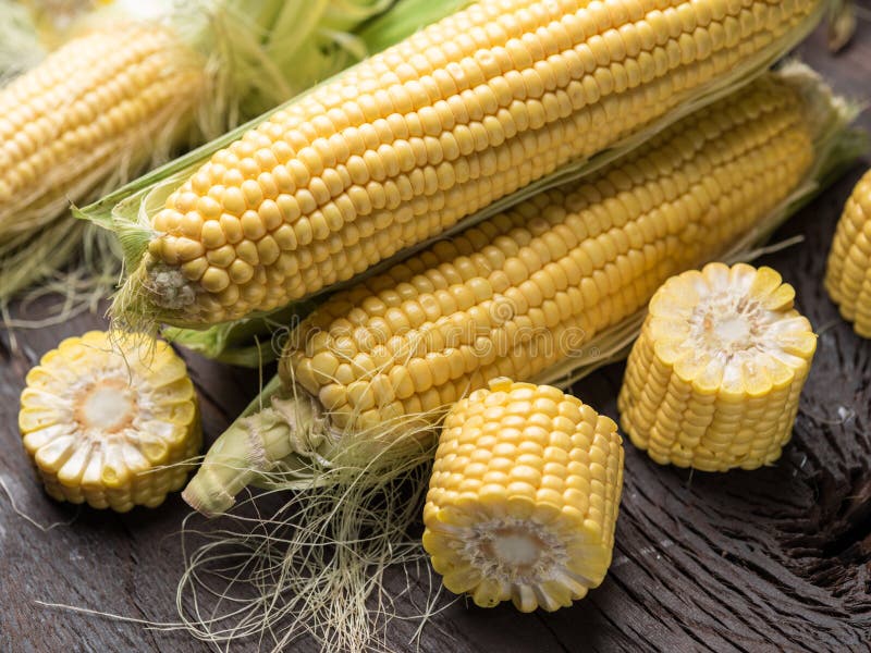 Ear of Maize or Corn on the Dark Wooden Background Stock Photo - Image ...