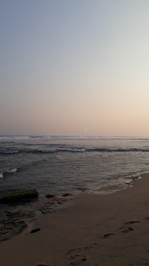 Early beach orange sky stock photo. Image of beach, sunset - 268956522