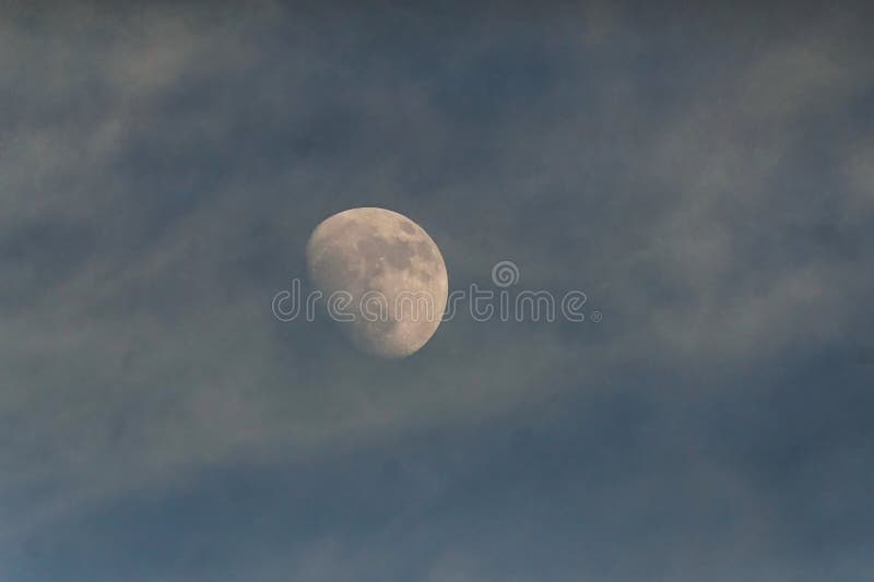 An Early Evening Moon among Light Clouds Stock Image - Image of ...