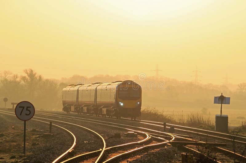 Early Morning Commuter Train at Sunrise. Stock Image - Image of morning ...