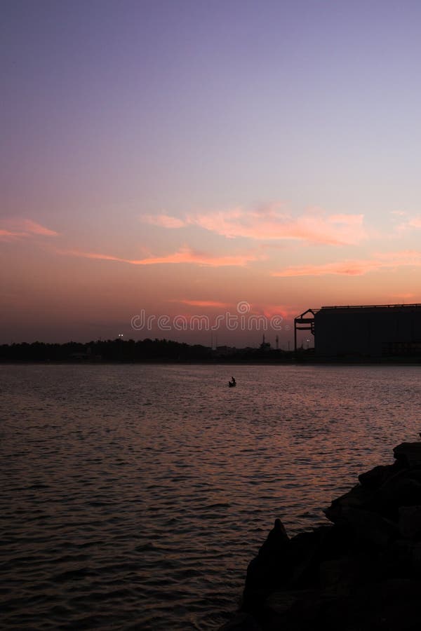 Early Morning Pink Sky with a Tiny Boat in Water Stock Photo - Image of ...