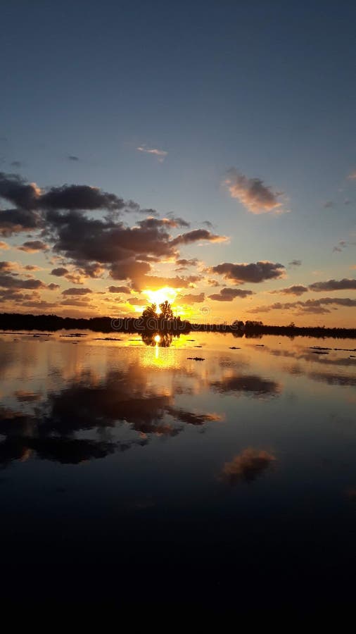 Early Morning Sunrise Over Water Stock Photo - Image of water, shadow ...