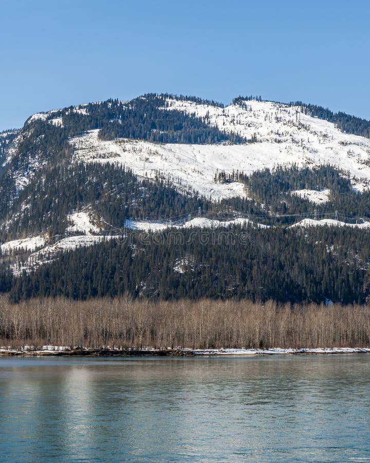 Early Spring Columbia River with Snow on Mountains Blue Sky British ...