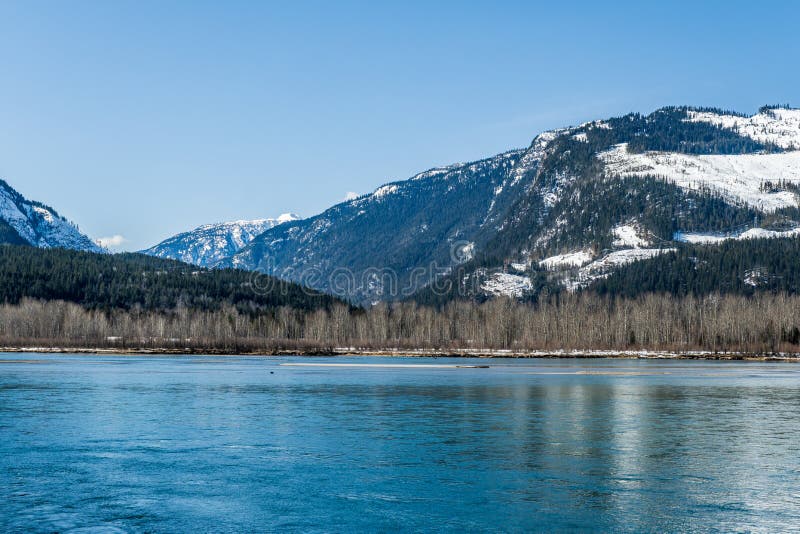 Early Spring Columbia River with Snow on Mountains Blue Sky British ...