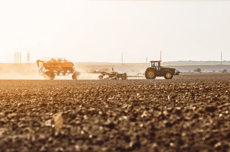 Early Spring in the Field. Plowed Land. Tractor. Field Work Editorial ...