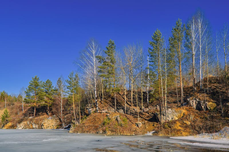 Early Spring Ice Melts on a Forest Lake Stock Image - Image of cloud ...