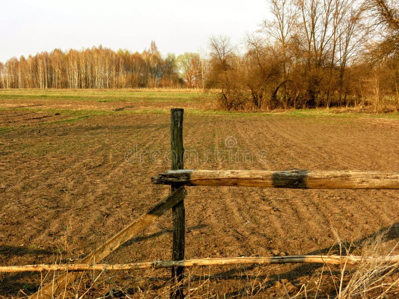 Early Spring Landscape with a Charred Wooden Fence Stock Photo - Image ...