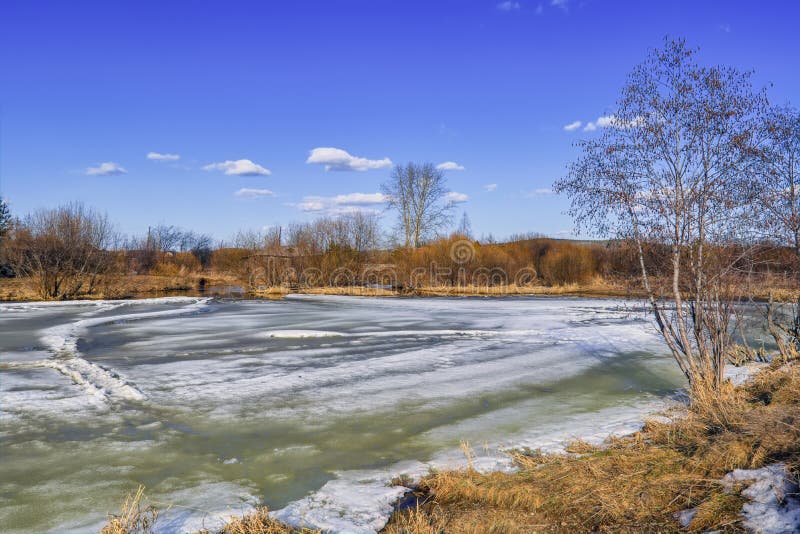 Early Spring Landscape Melts Ice on a Small River at the Edge of the ...