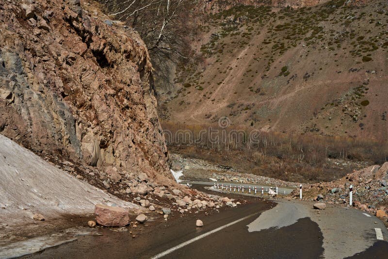 Early Spring in the Mountains. the Rocks Fell on the Road. Dangerous ...