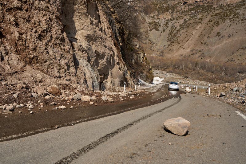 Early Spring in the Mountains. the Rocks Fell on the Road. Dangerous ...