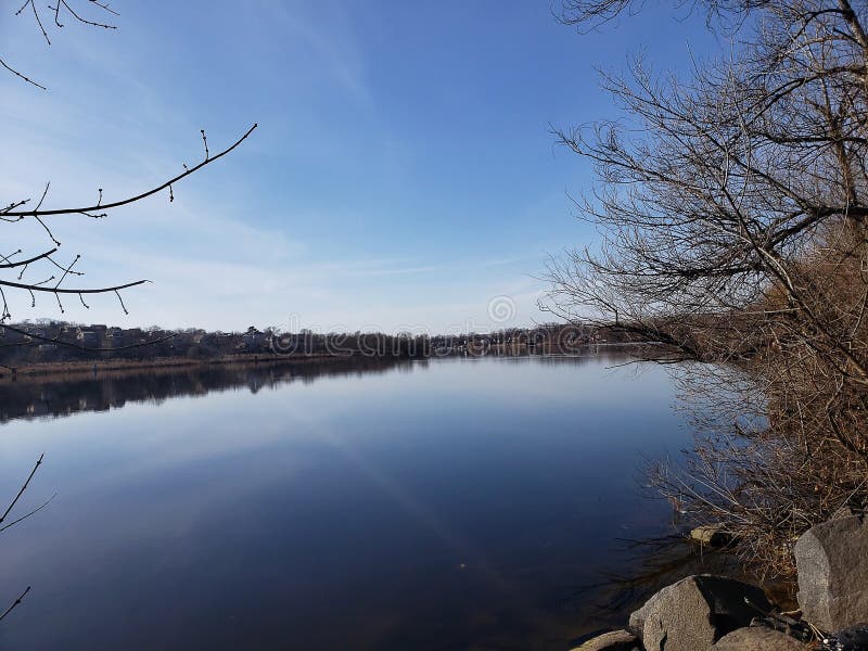 View of the River from the Shore on a Clear Day Stock Photo - Image of ...