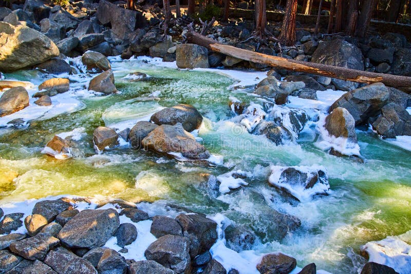Early Spring River at Yosemite with Frosted Rocks and Icy Waters Stock ...