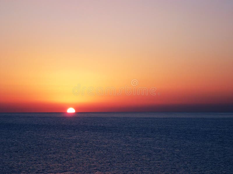 Early Sunrise Over the Calm Sea. the Sun is Rising Stock Image - Image ...