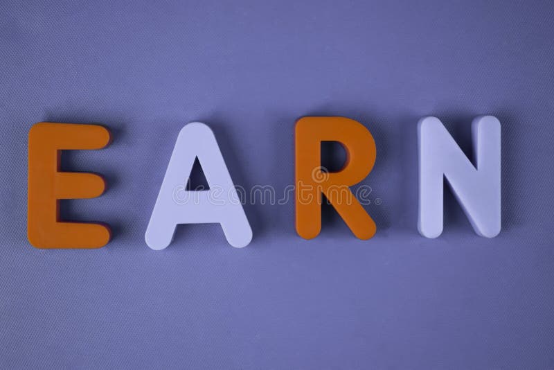 Earn Word Written with Different Colored Letter Blocks on a Blue ...