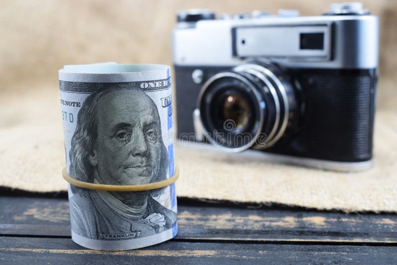 The Camera On Money (the Photo - As Earnings) Stock Photo - Image of ...