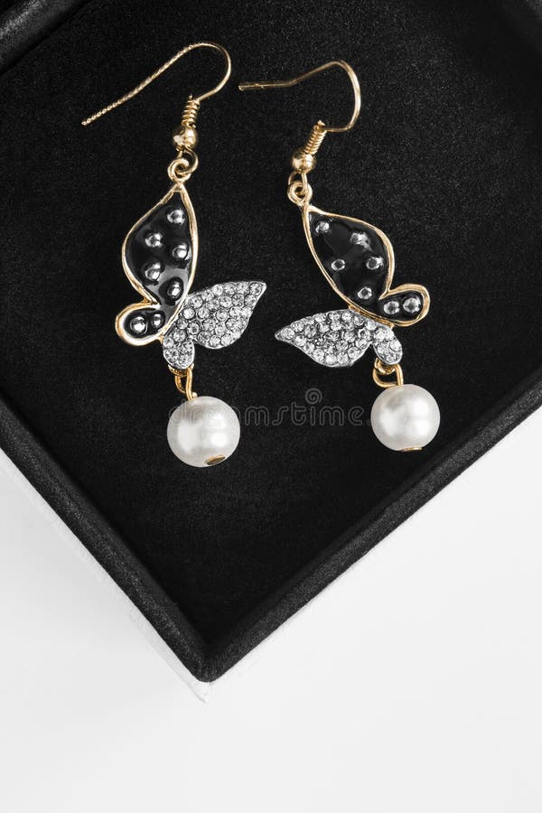 Earrings in a box stock image. Image of glamour, gold - 87570857