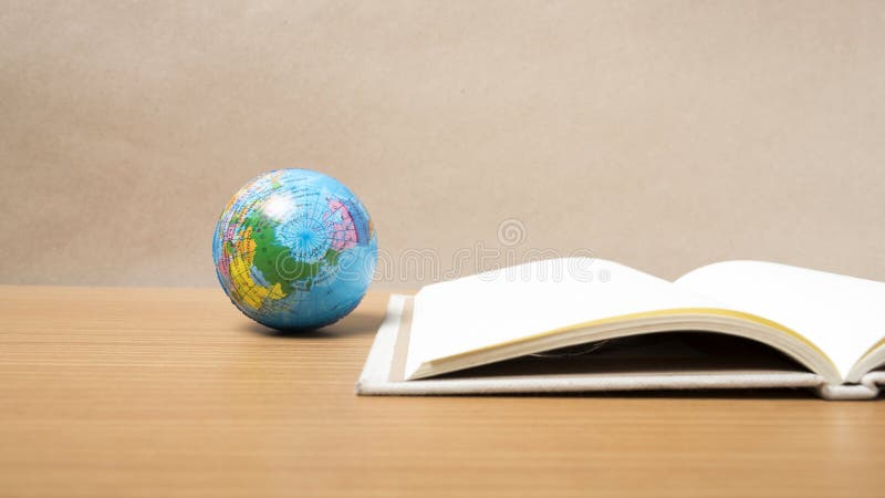 Earth ball and notebook stock photo. Image of planet - 57955998