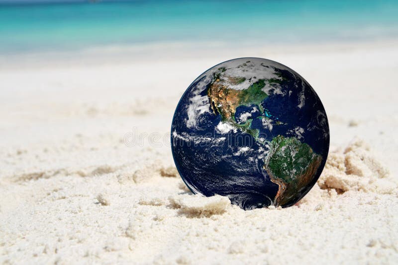 The Earth on Beach, Including Elements Furnished by NASA Stock Photo ...