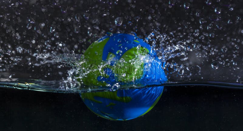 Earth dropped in water stock photo. Image of generated - 29283110