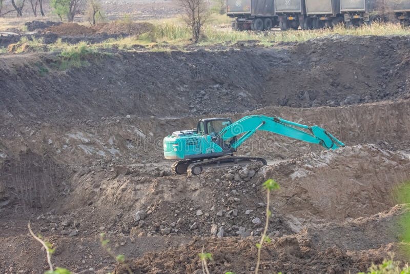 Earth Excavator Digger Loader Machine Digging the Soil at Mining Site ...