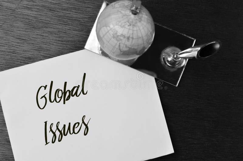 Earth Globe and White Paper Written with GLOBAL ISSUES Stock ...