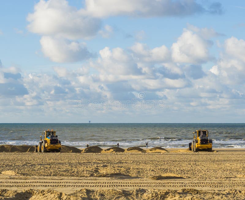 Earth Movers Working in Their Equipment Machines at the Beach for ...