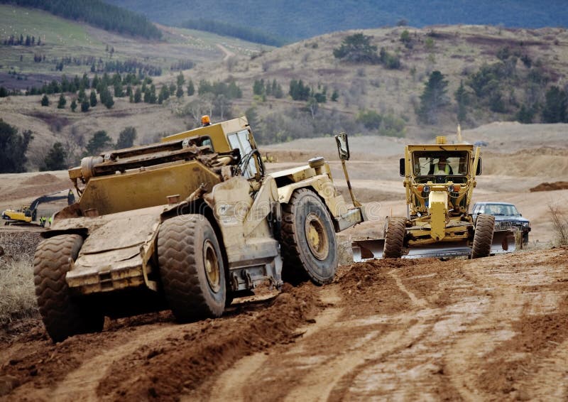 Earth Moving Equipment at Work Stock Image - Image of scraping ...