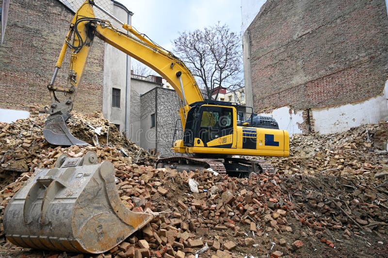 Earth Moving Machine Tearing Down an Building Stock Image - Image of ...