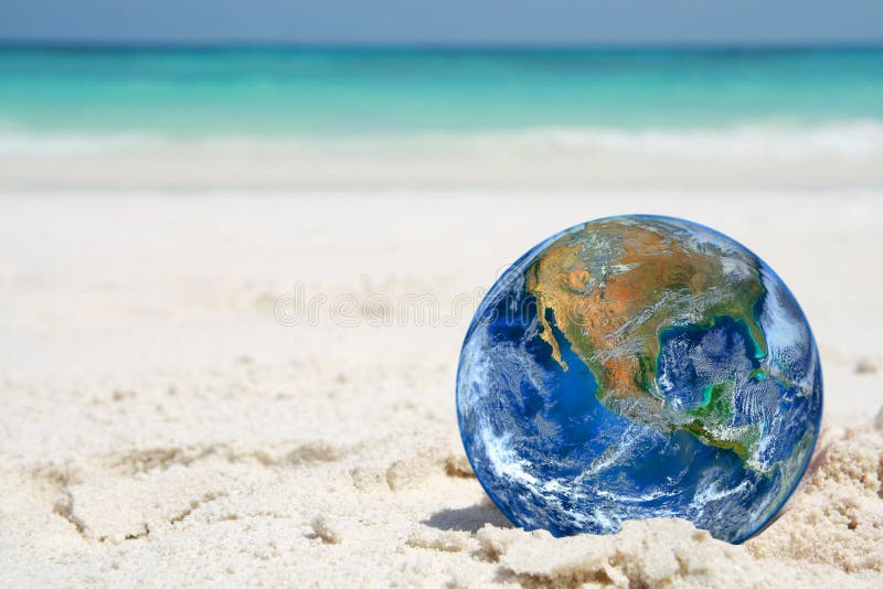 The Earth on Sand Beach, Including Elements Furnished by NASA Stock ...