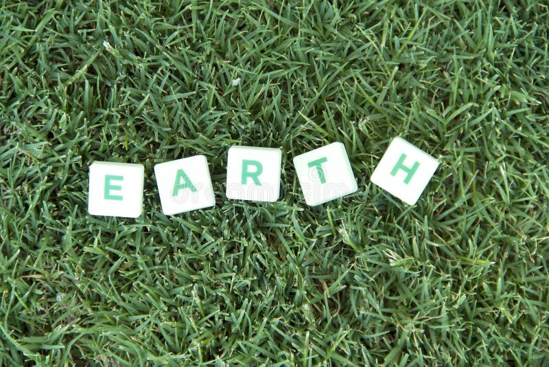 Earth Text on the Grass stock photo. Image of environment - 66704406