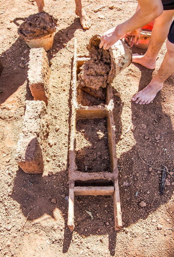 Earthen brick making stock photo. Image of clay, home - 64650242