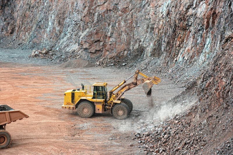 Earthmover in a Open Pit Mine Quarry. Porphyry Rock Stock Image - Image ...