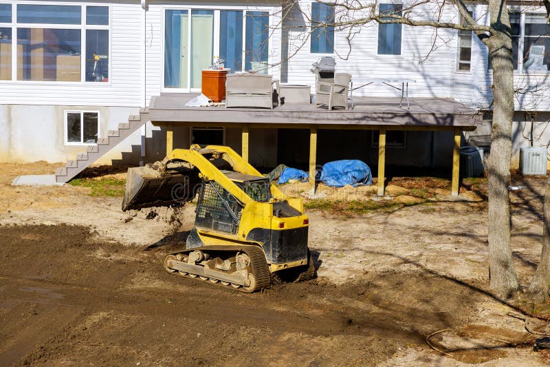 At Earthmoving Site, Tractor is Leveling Ground during Work on a ...