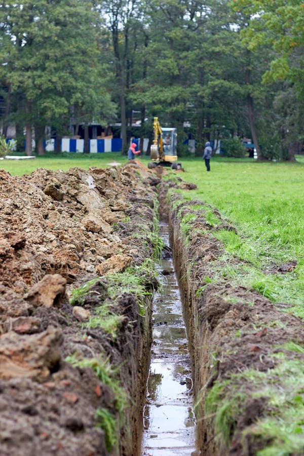 Earthwork Construction Work Using a Mini Excavator Technique. Trench ...